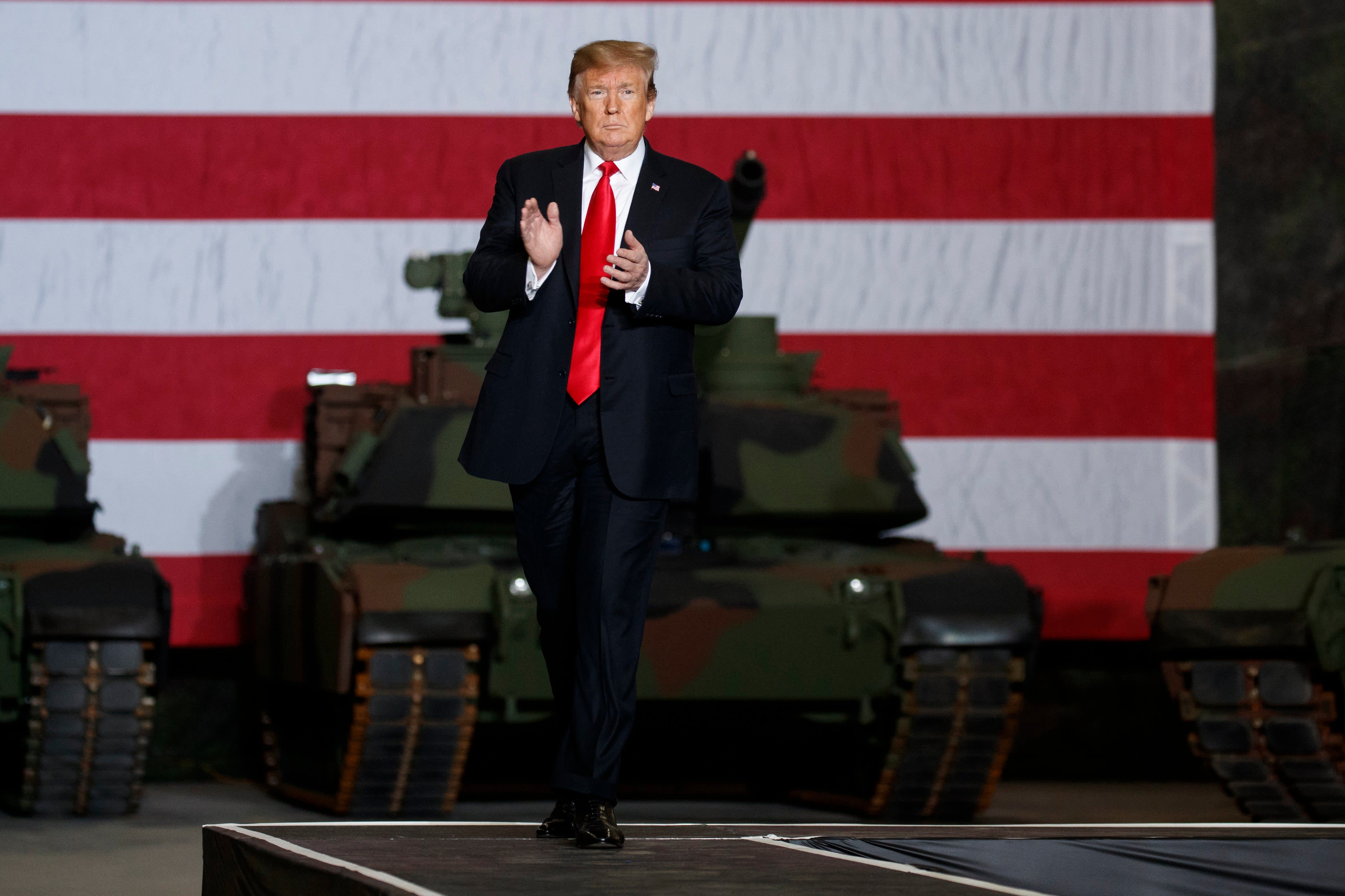 Trump attacks on McCain bomb at tank factory